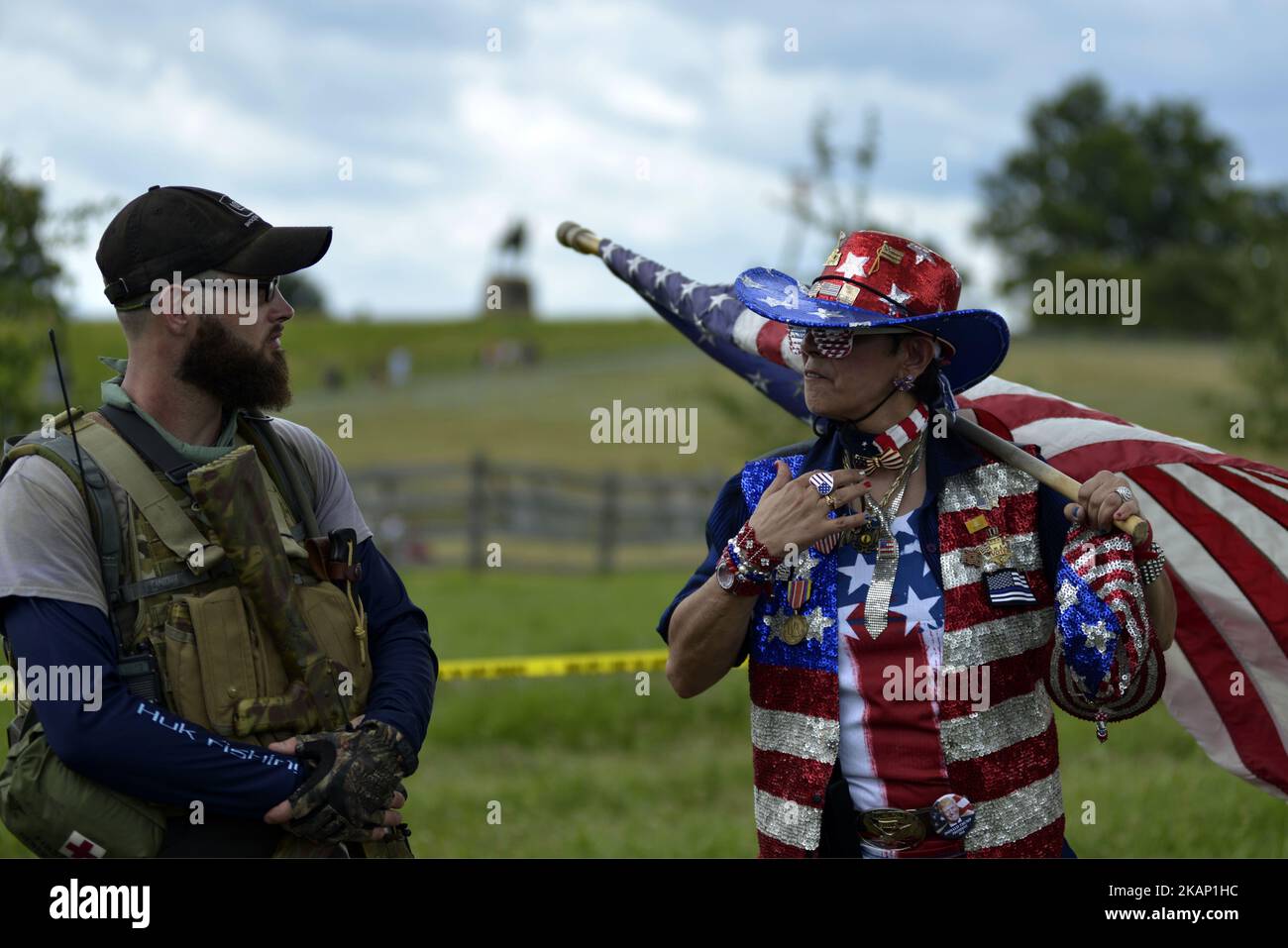 Members of patriotic groups assemble for a rally in reaction to a ...