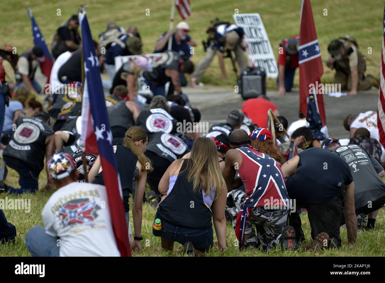 Members of patriotic groups assemble for a rally in reaction to a ...
