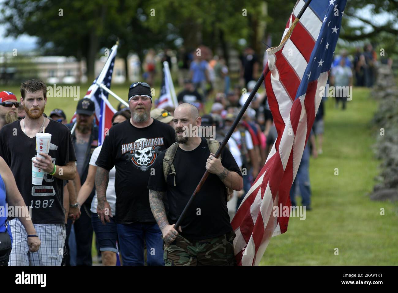 Members of patriotic groups assemble for a rally in reaction to a ...