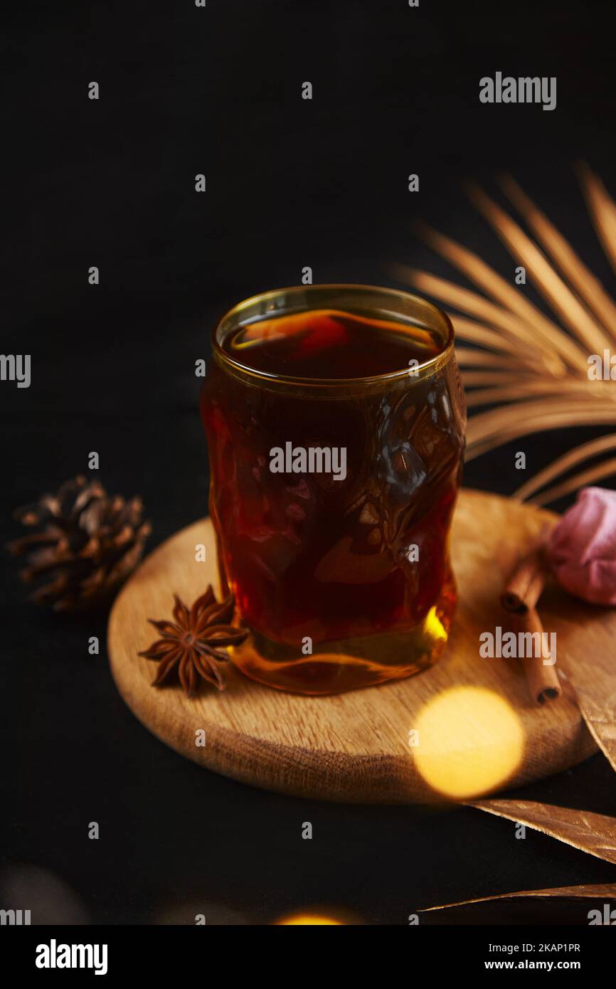 Festive coffee with cinnamon and cardamom among Christmas decorations ...