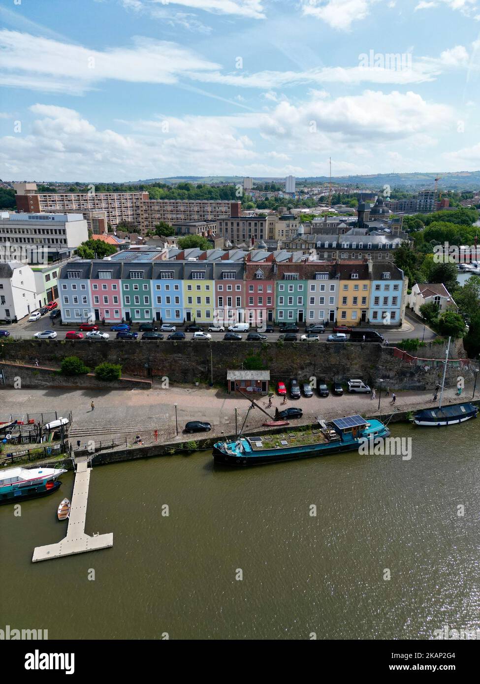 An aerial view of Bristol with a river and dense, colorful residential ...