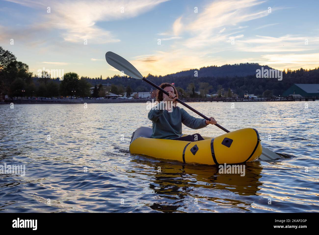 Adventurous Woman Kayaking on an Inflatable Kayak in the Pacific Ocean ...