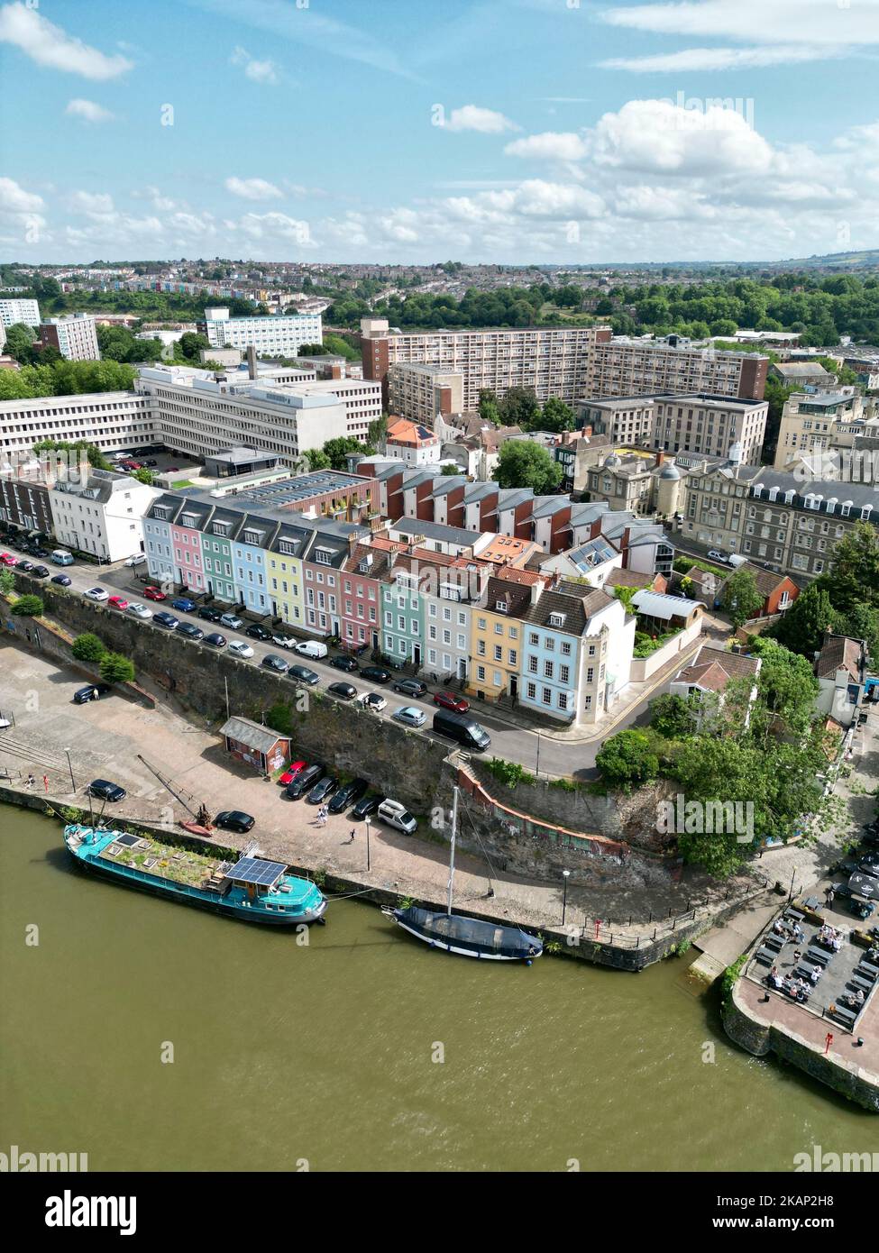 An aerial view of Bristol with a river and dense, colorful residential ...