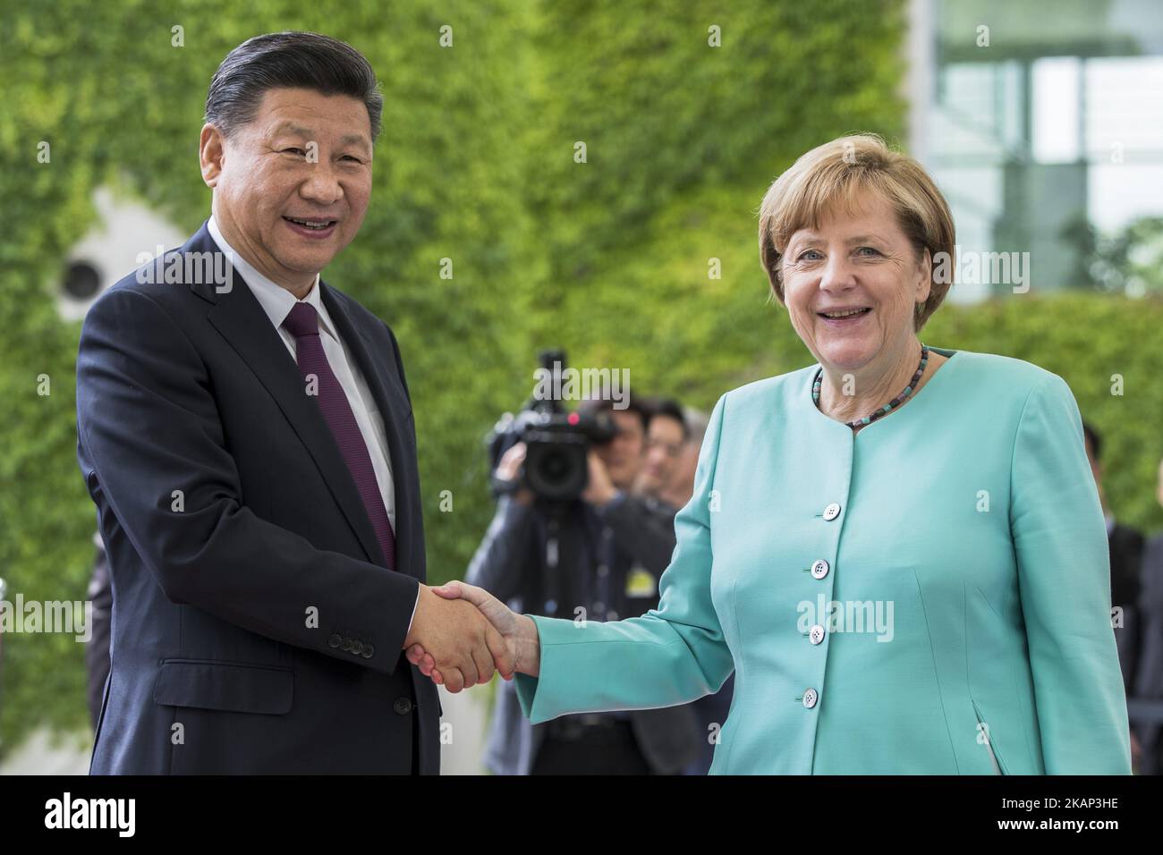 German Chancellor Angela Merkel greets China's President Xi Jinping ...