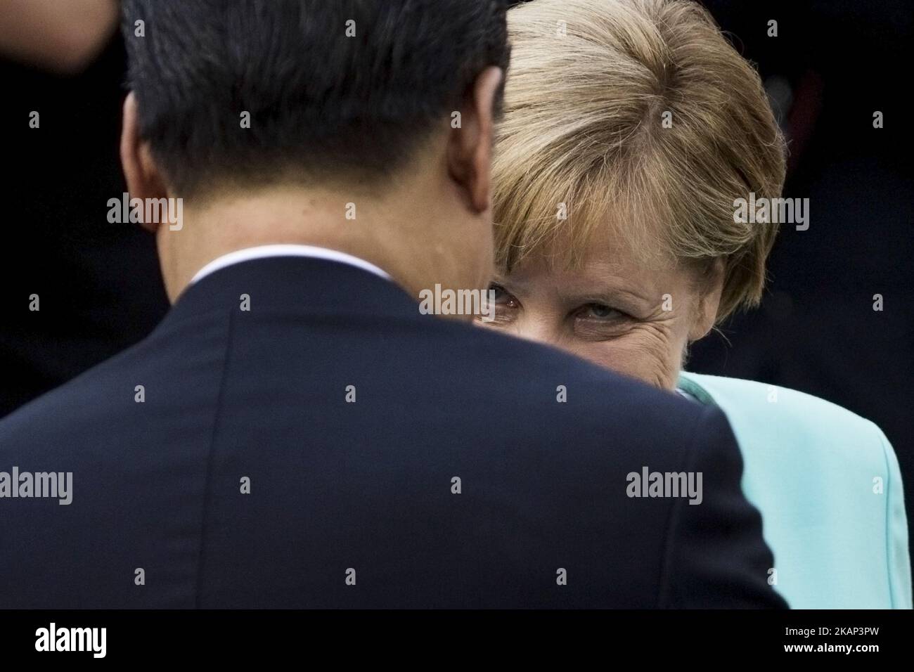 China's President Xi Jinping and German Chancellor Angela Merkel shake ...