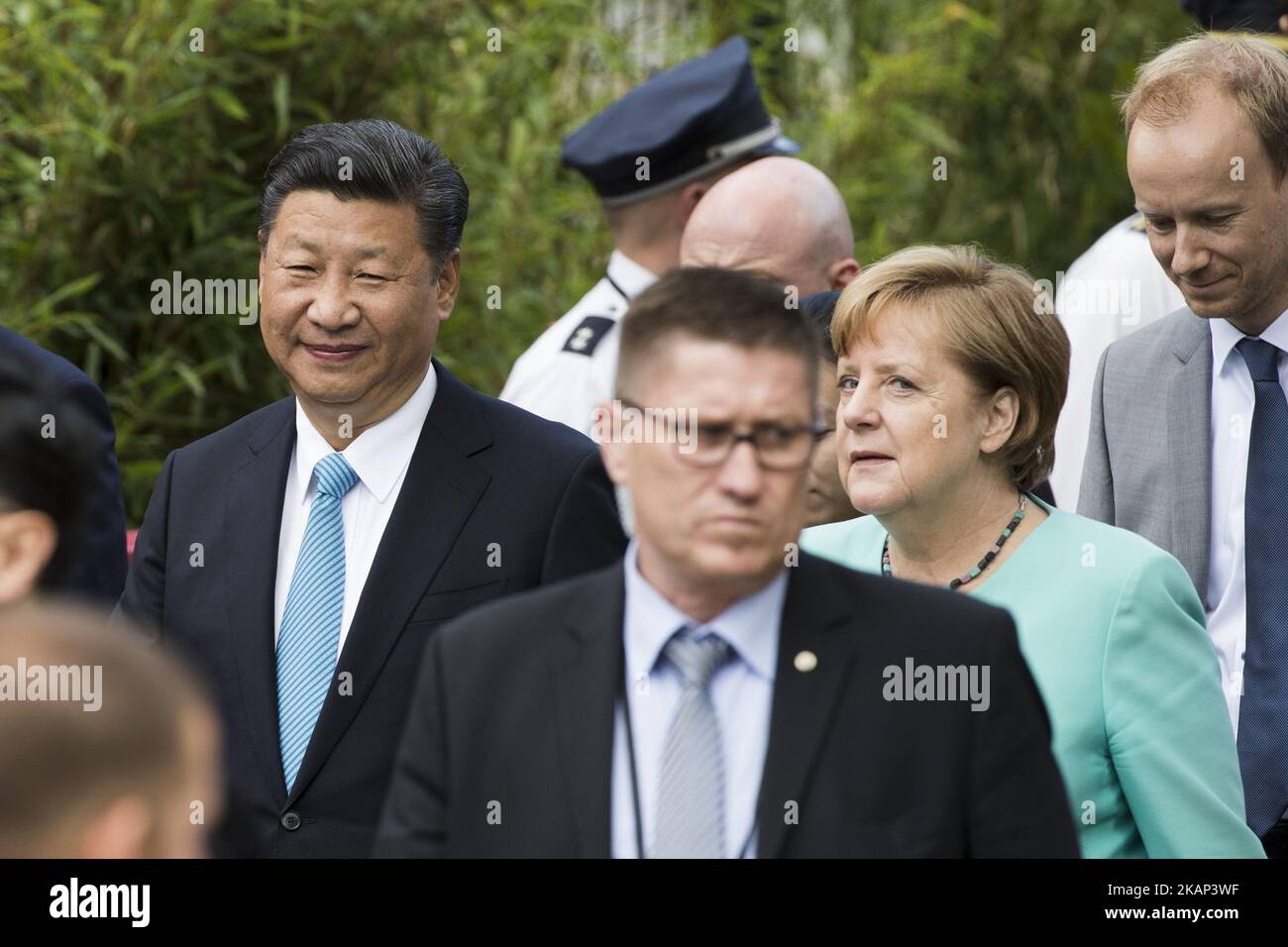 China's President Xi Jinping (L) and German Chancellor Angela Merkel ...