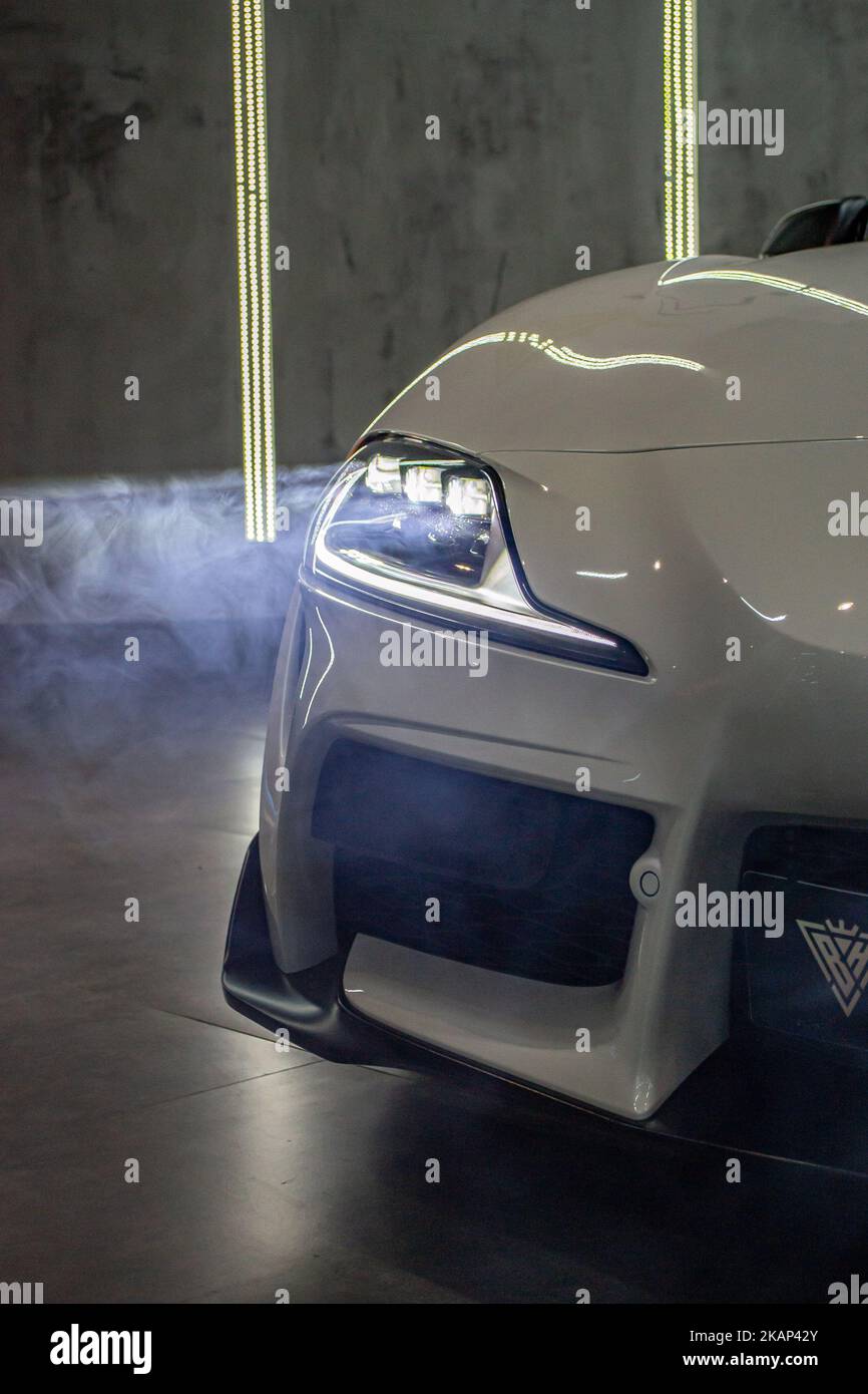 White Toyota Supra MK5 headlights on in the fog Stock Photo - Alamy