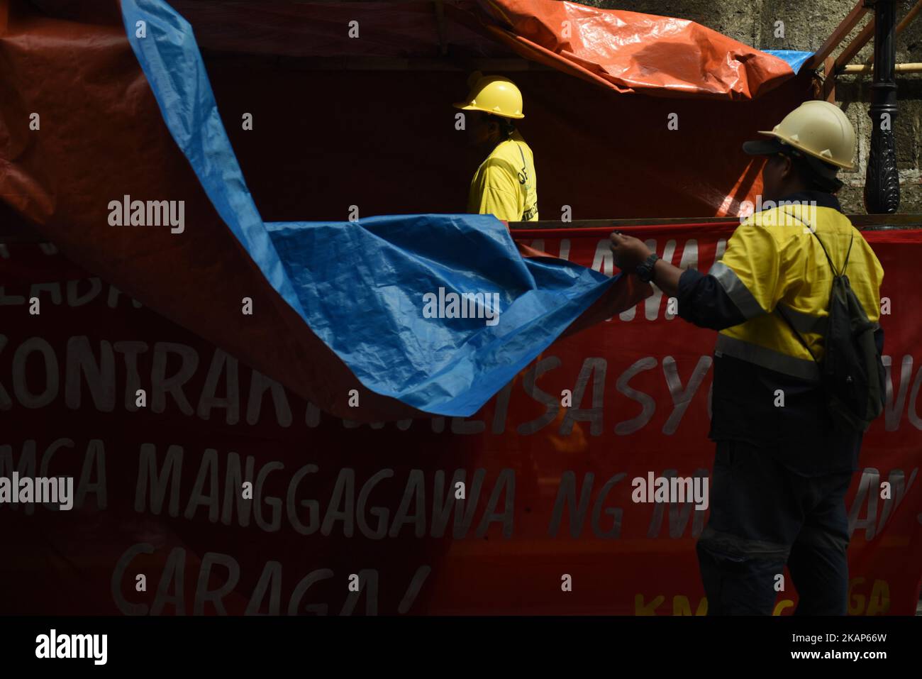 Miners from the CARAGA region in Mindanao set up their tents in front ...