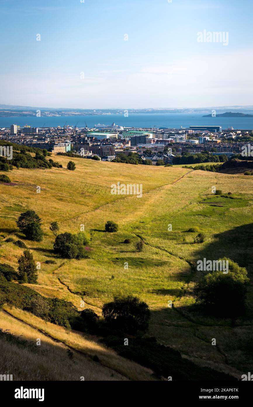 A vertical aerial view of the Edinburgh City in the background of a ...