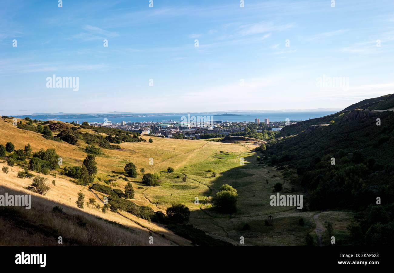 An aerial view of the Edinburgh City in the background of a green ...