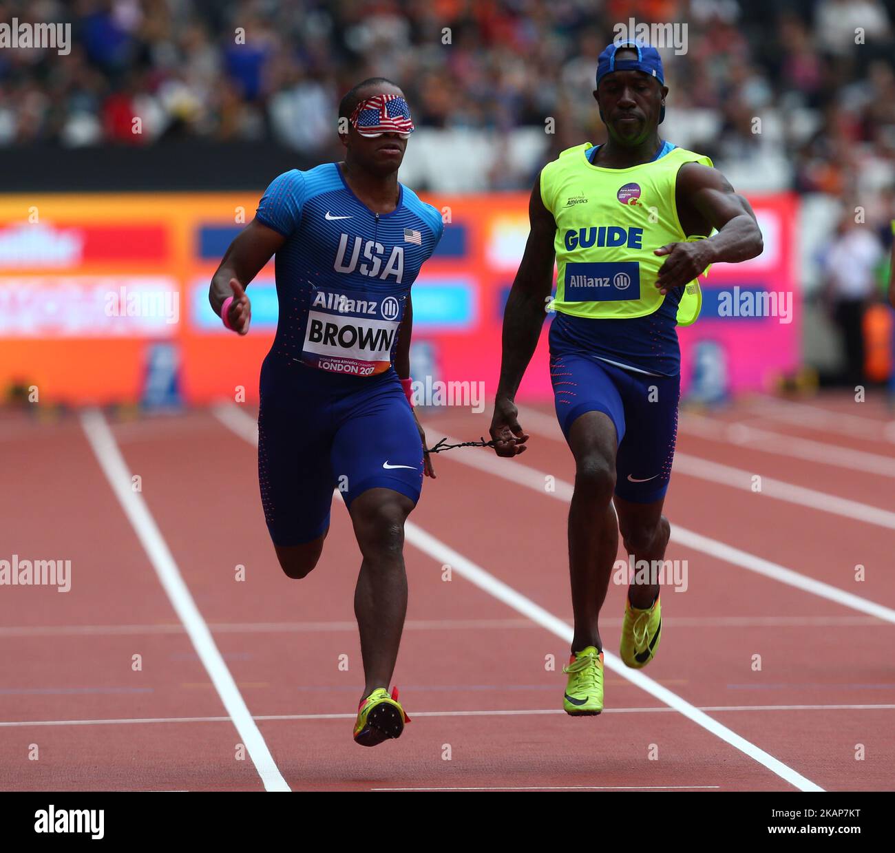 David Brown of USA and Guide Jerome Avery Men's 100m T11 Round 1 Heat 3 ...
