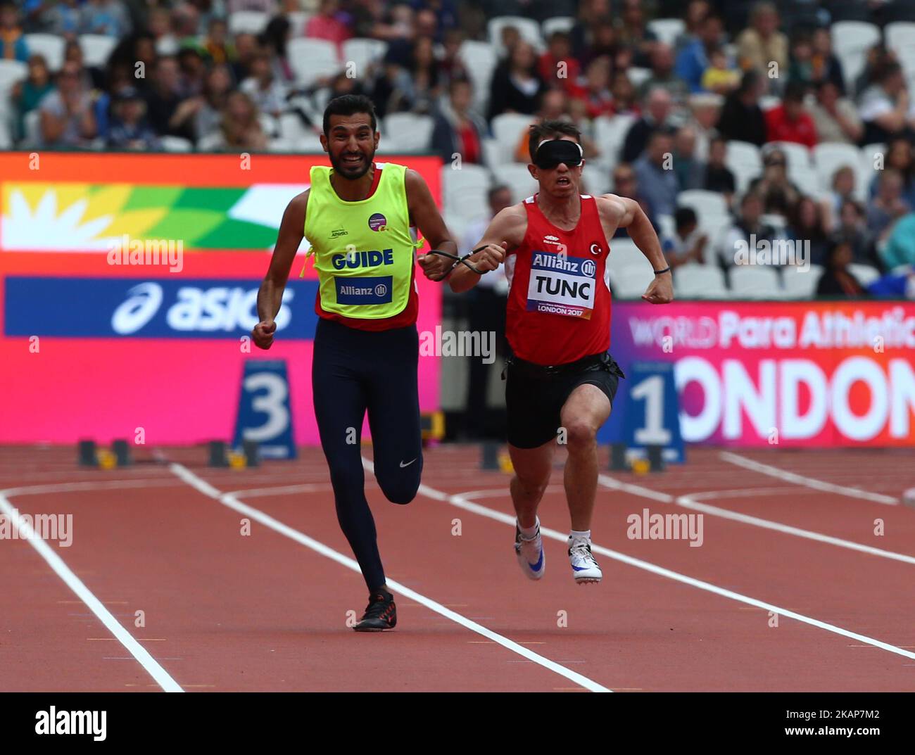 Mehmet Tunc of Turkey and Guide Bugra Han Kocabeyoglu Men's 100m T11 ...