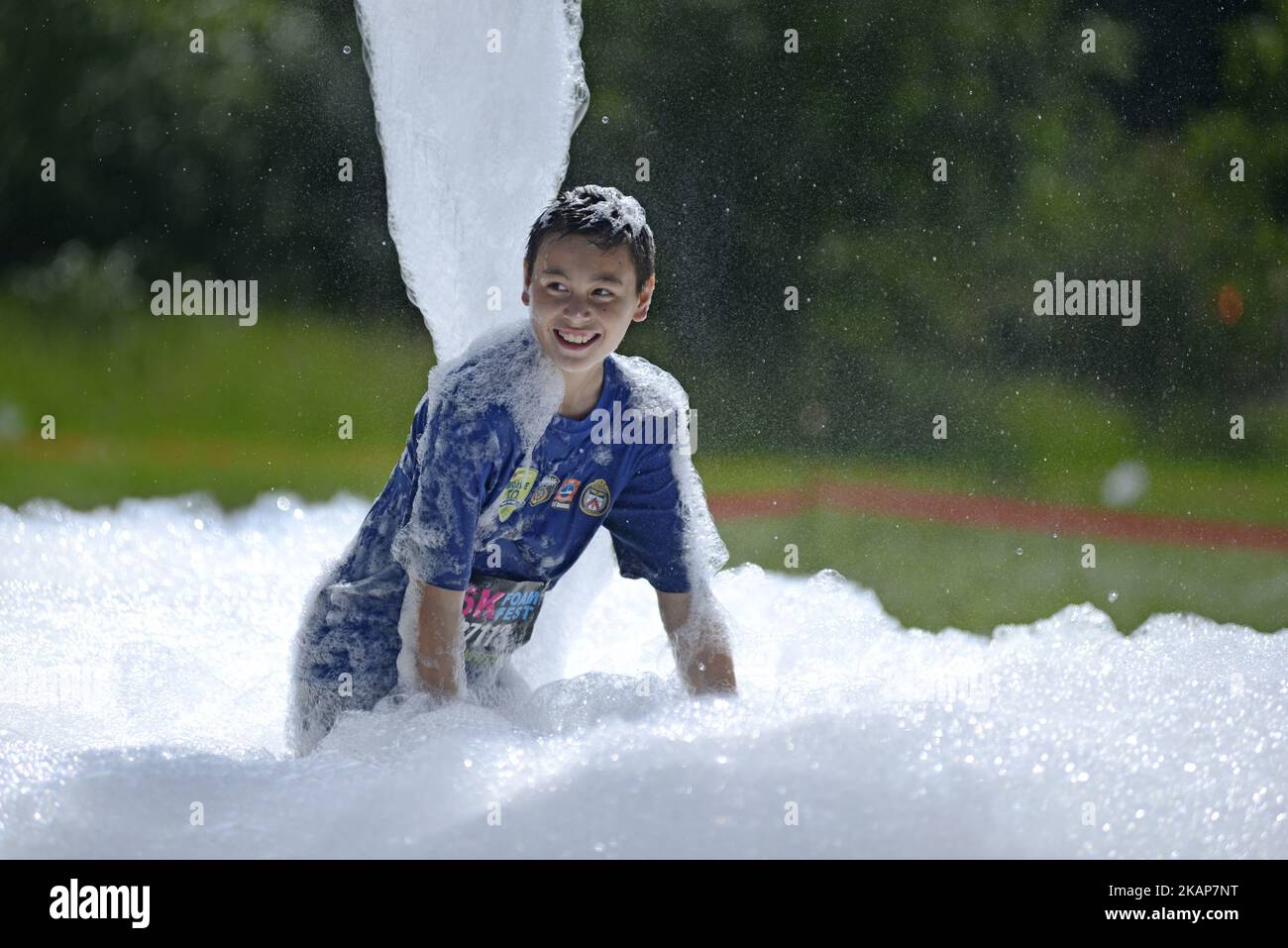 Locals play with foam during the Foam Fest in Toronto, Canada on July ...