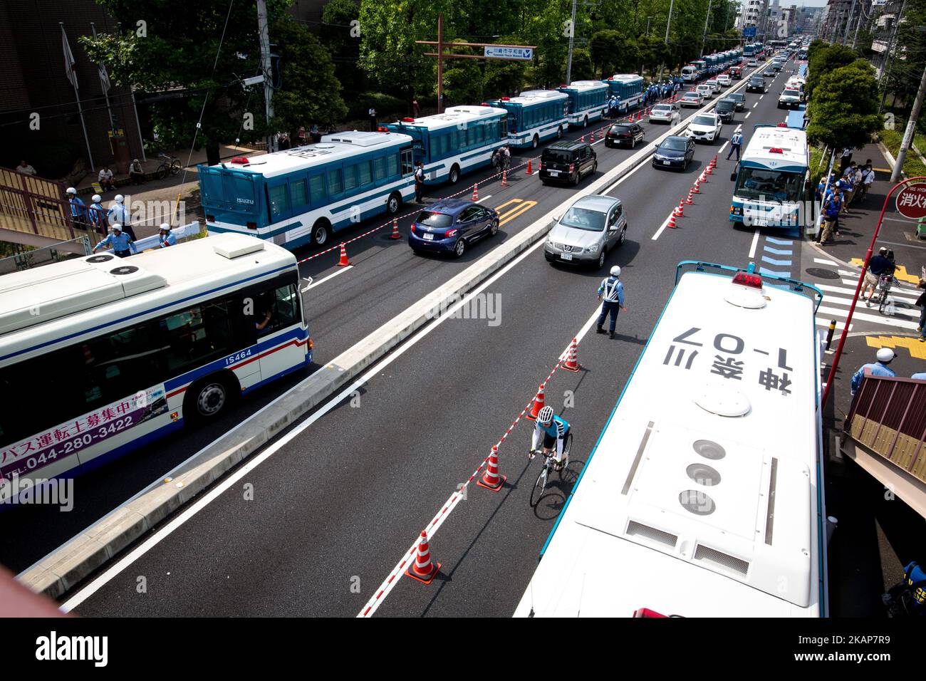 Japanese police buses are seen parked on the road during a counter ...