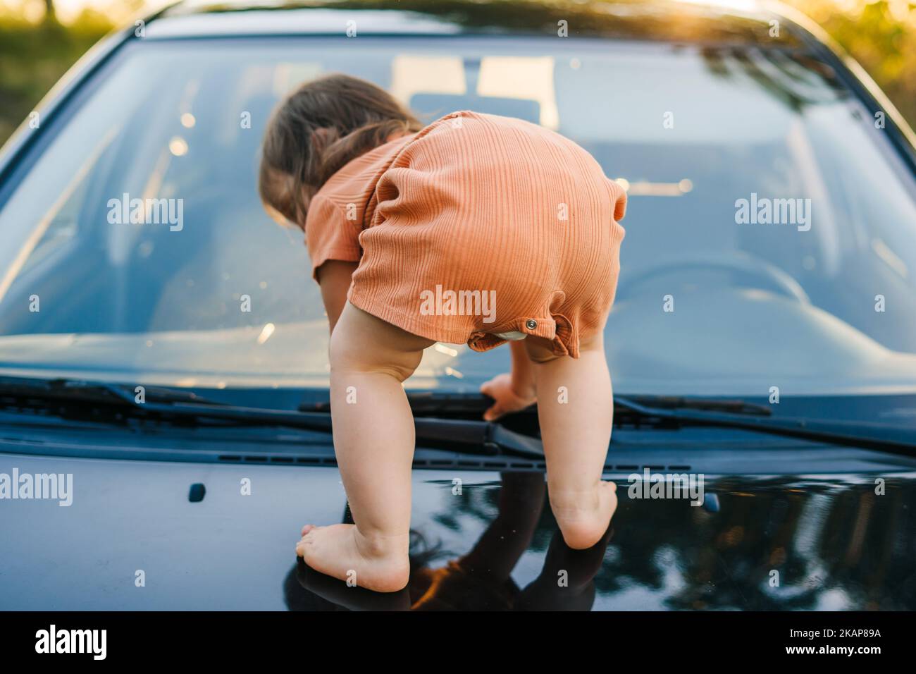 The baby girl trying to stand up and not hold on to anything on the ...