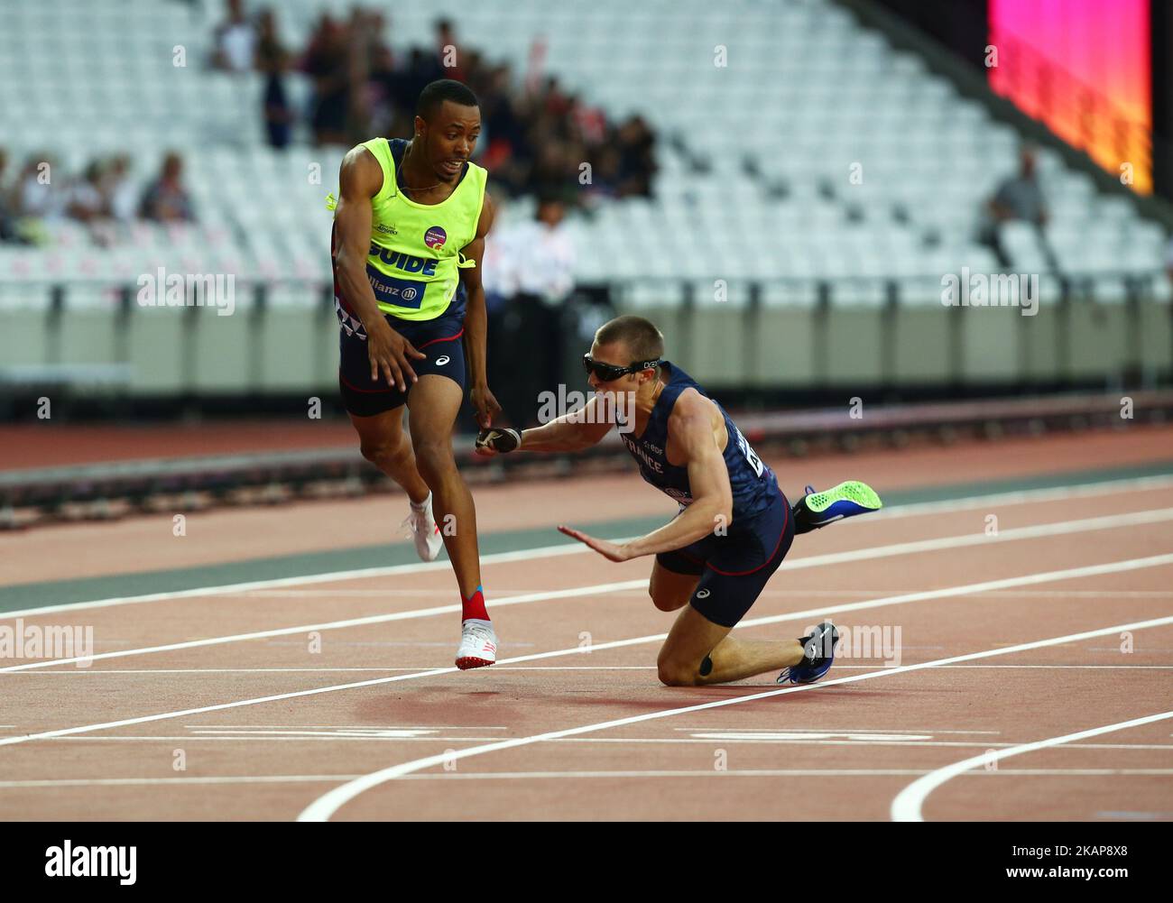 Timothee Adolphe with Guide Jeffrey Lami compete in Men's 400m T11 ...