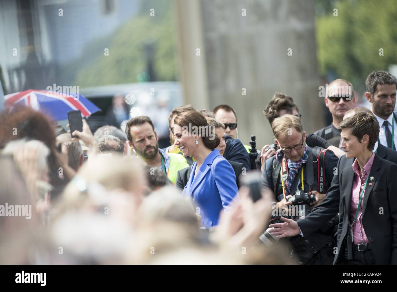 Kate, the Duchess of Cambridge (C) greats people during her visit in ...