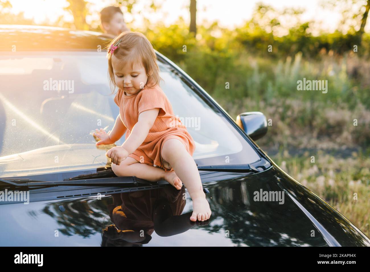Kid little child baby girl sitting alone without supervision on the ...