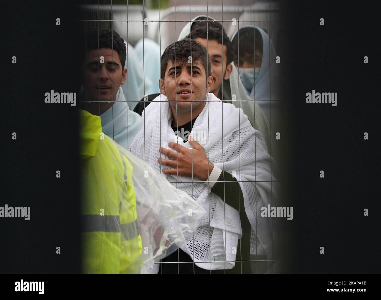 A view of people thought to be migrants inside the Manston immigration ...