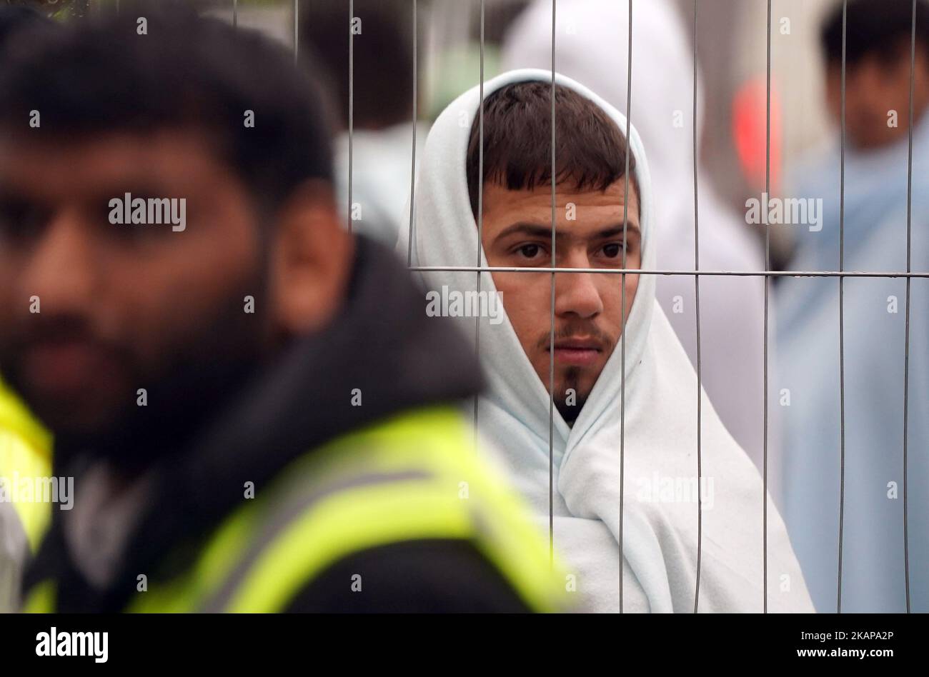 A view of people thought to be migrants inside the Manston immigration ...