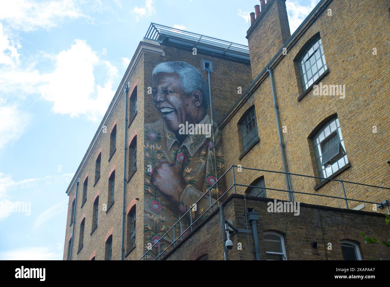 A giant portrait of Nelson Mandela is seen on a wall of Camden, London ...