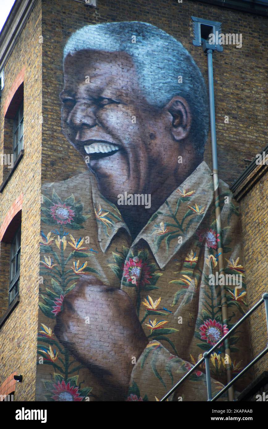 A giant portrait of Nelson Mandela is seen on a wall of Camden, London ...