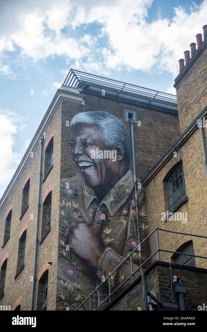 A giant portrait of Nelson Mandela is seen on a wall of Camden, London ...