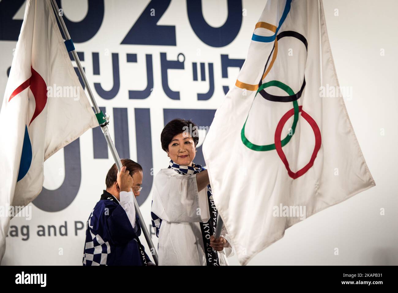 Tokyo Gov. Yuriko Koike carries an Olympic flag during the Tokyo 2020 ...