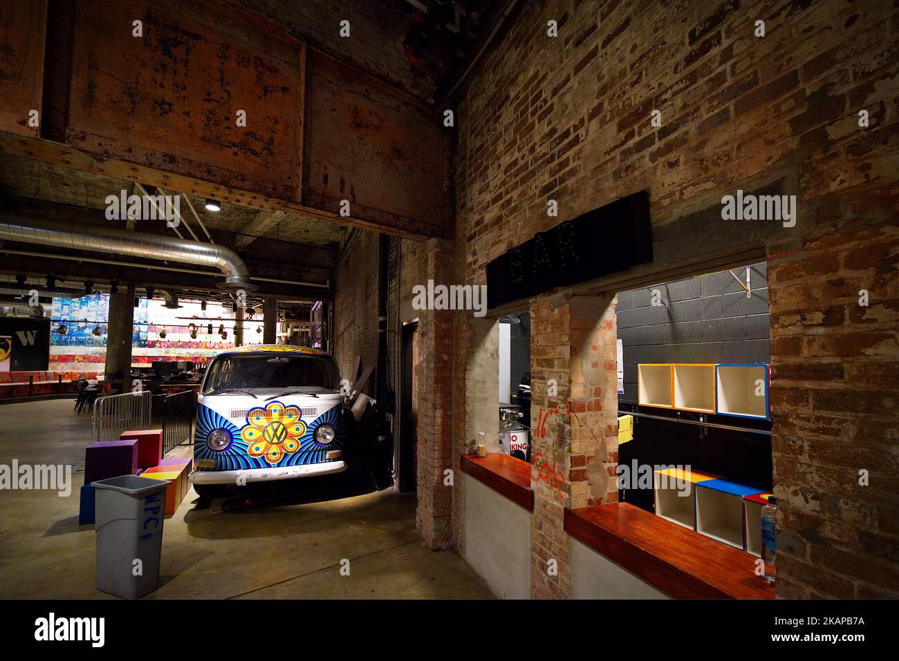 Large steel beams and exposed brick wall from the original structure ...