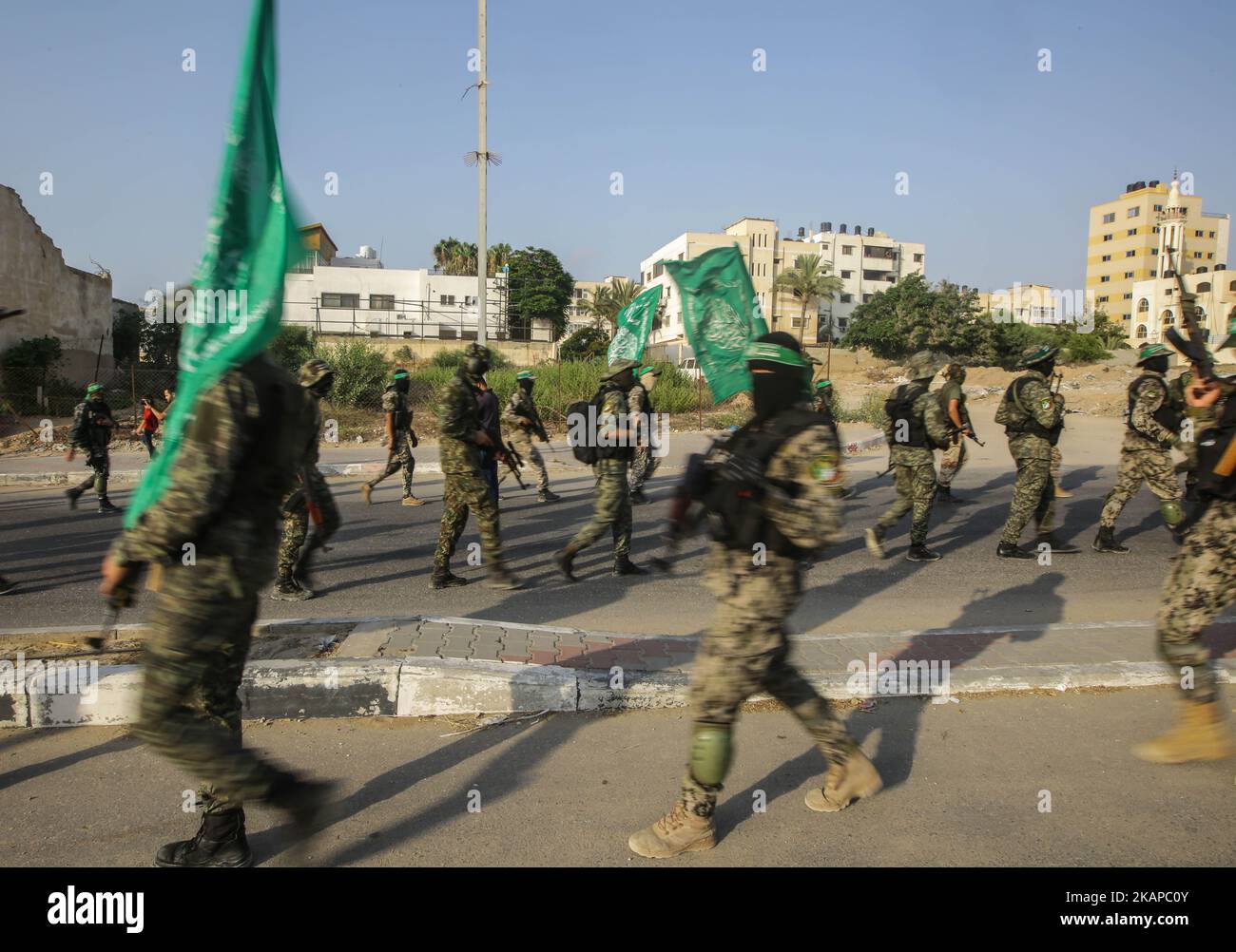 Members of Palestinian groups' armed wings march during a parade ...