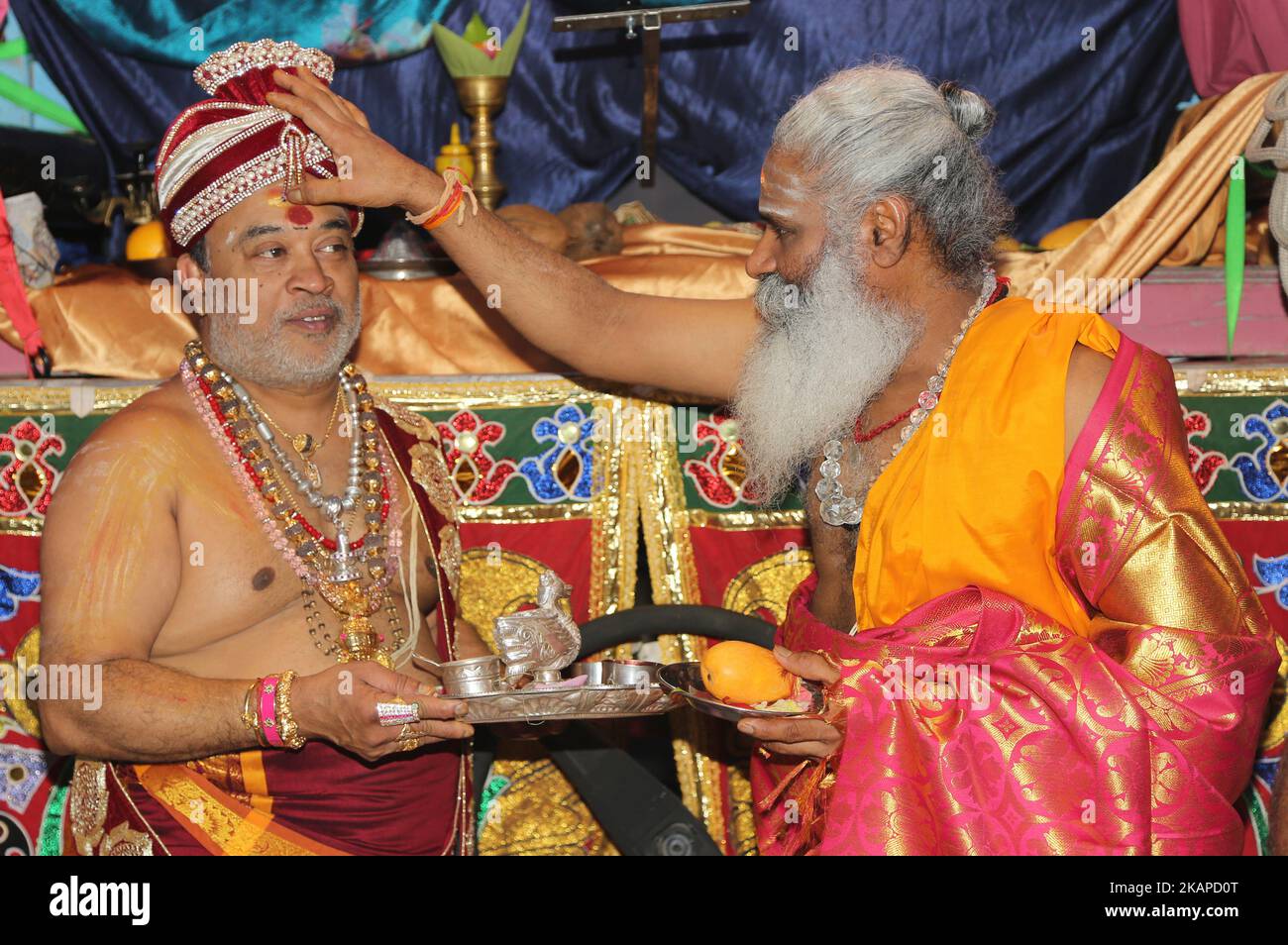 Tamil Hindu priest receives blessings during the Sappram Thiruvizha ...