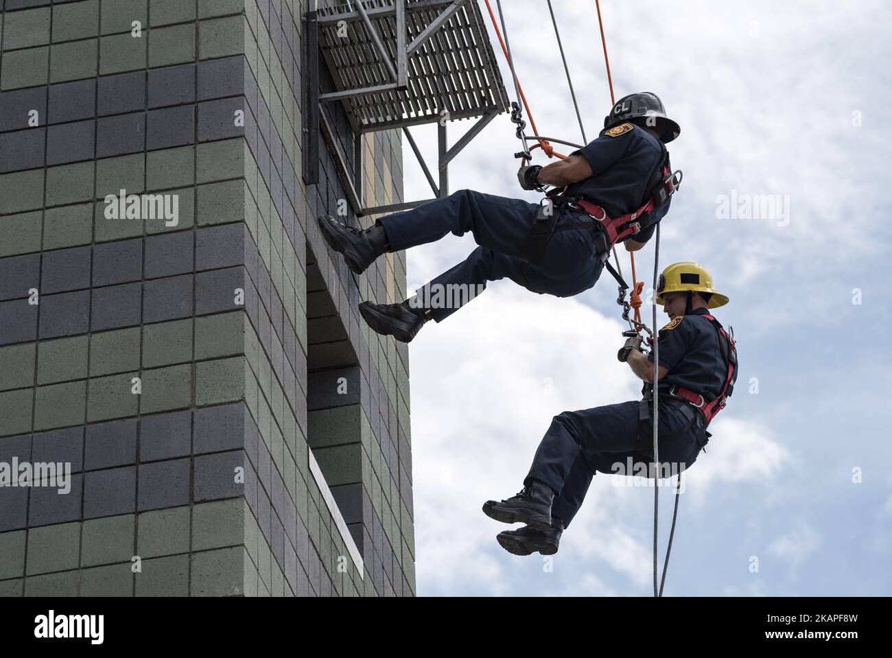 Graduates of the Los Angeles Fire Department Academy during a ...