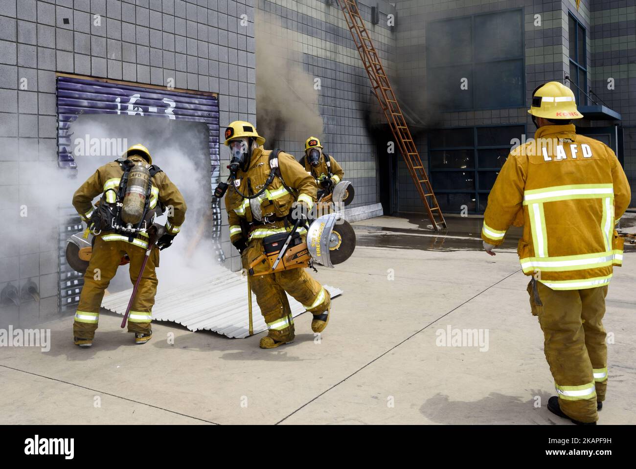 Graduates of the Los Angeles Fire Department Academy during a ...