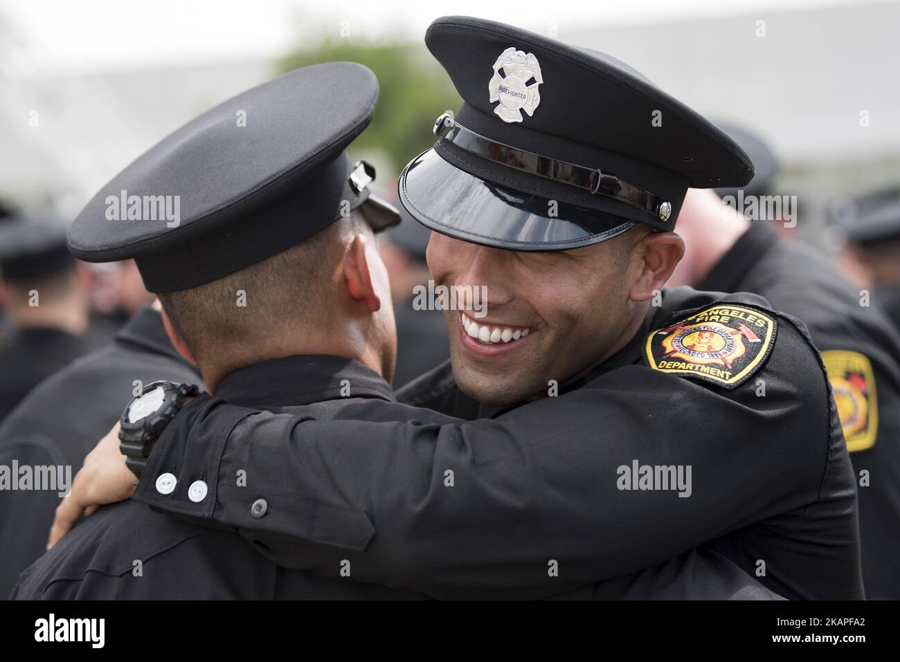 Graduates of the Los Angeles Fire Department Recruit Academy celebrate ...