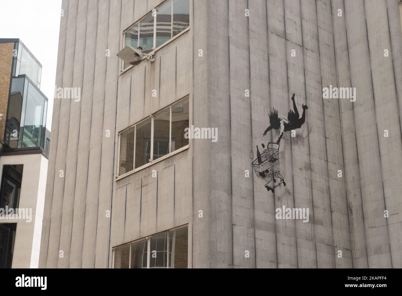 The falling shopper banksy hi-res stock photography and images - Alamy