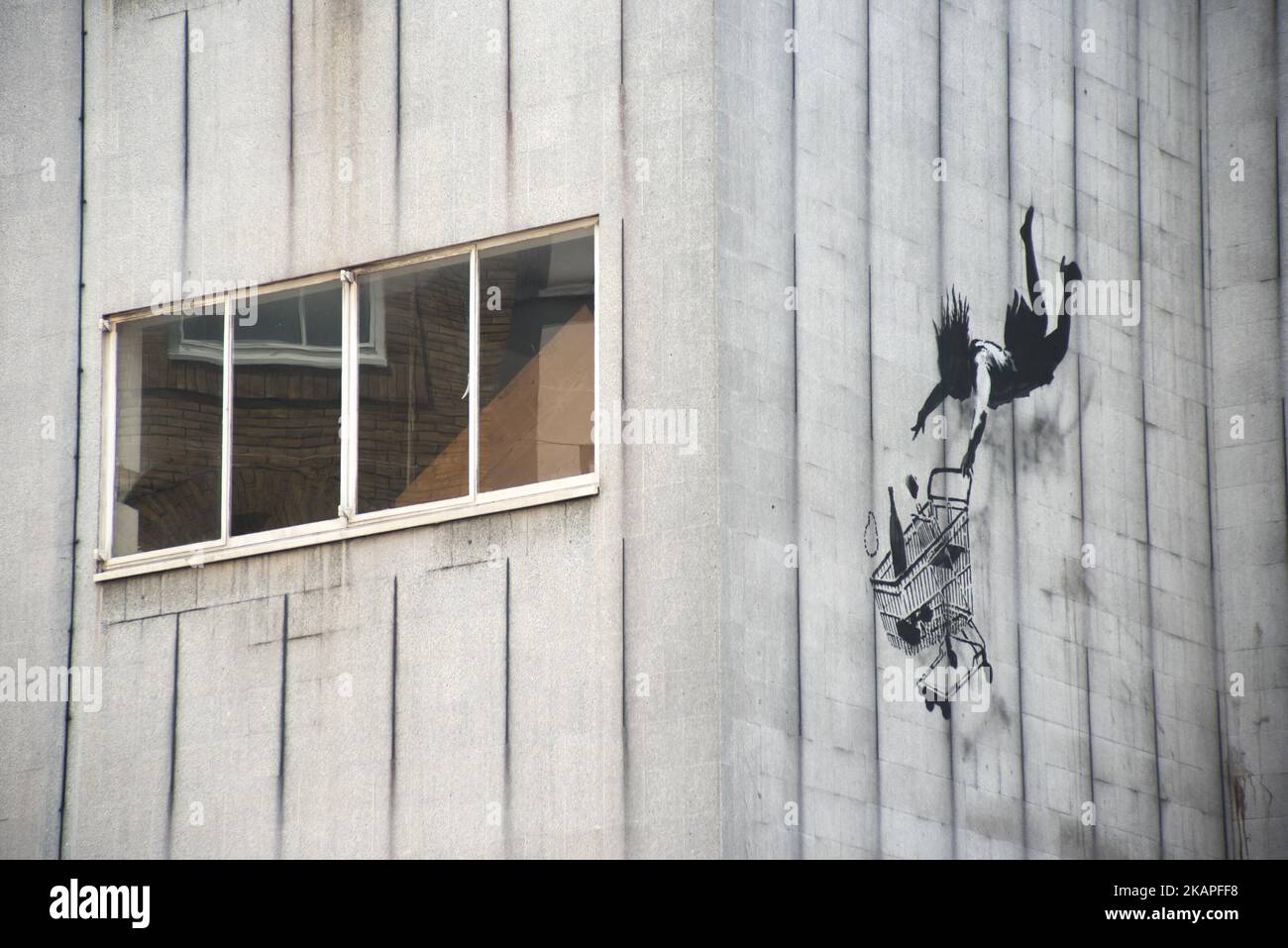 Falling shopper banksy hi-res stock photography and images - Alamy