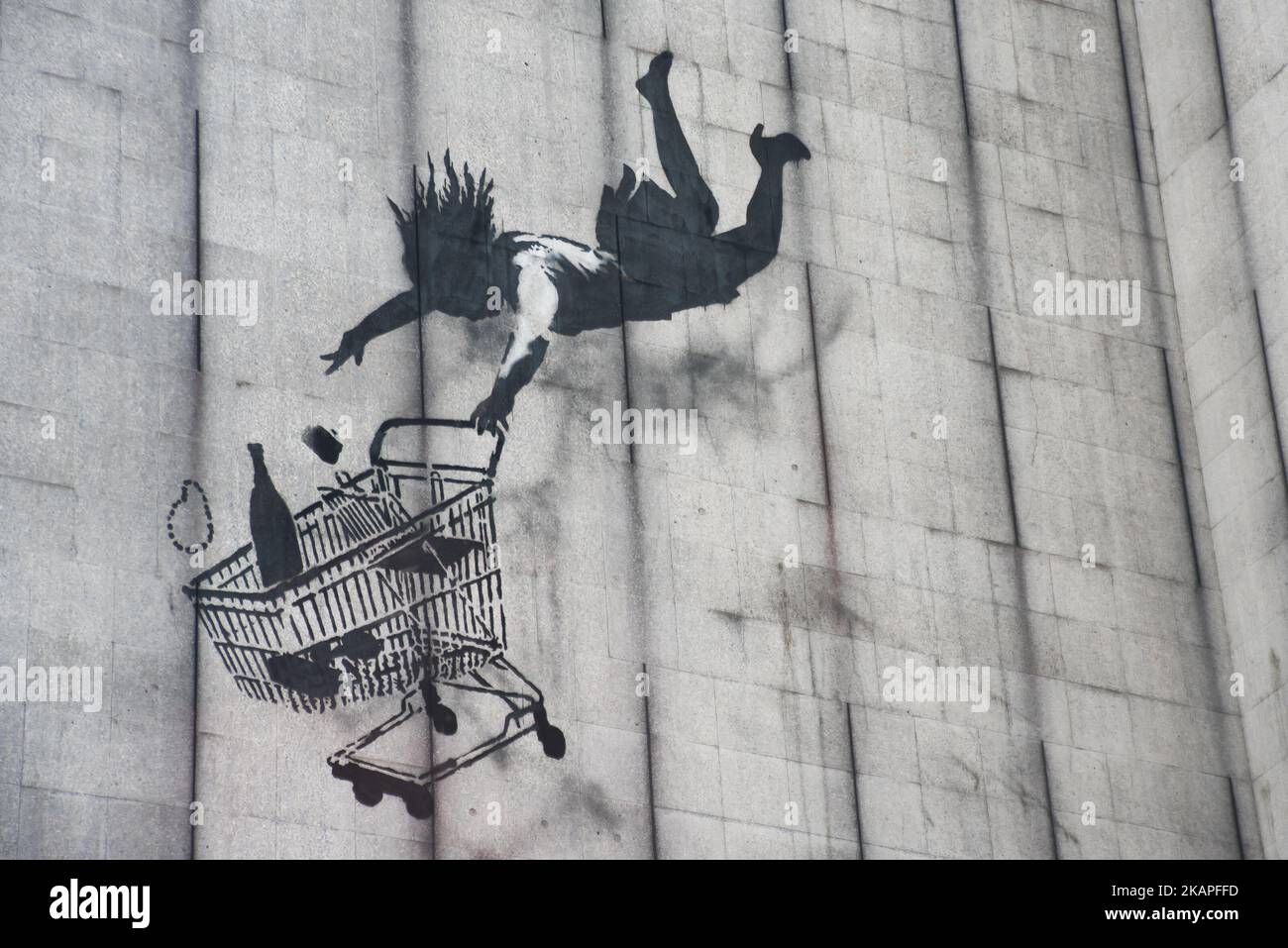 The falling shopper banksy hi-res stock photography and images - Alamy