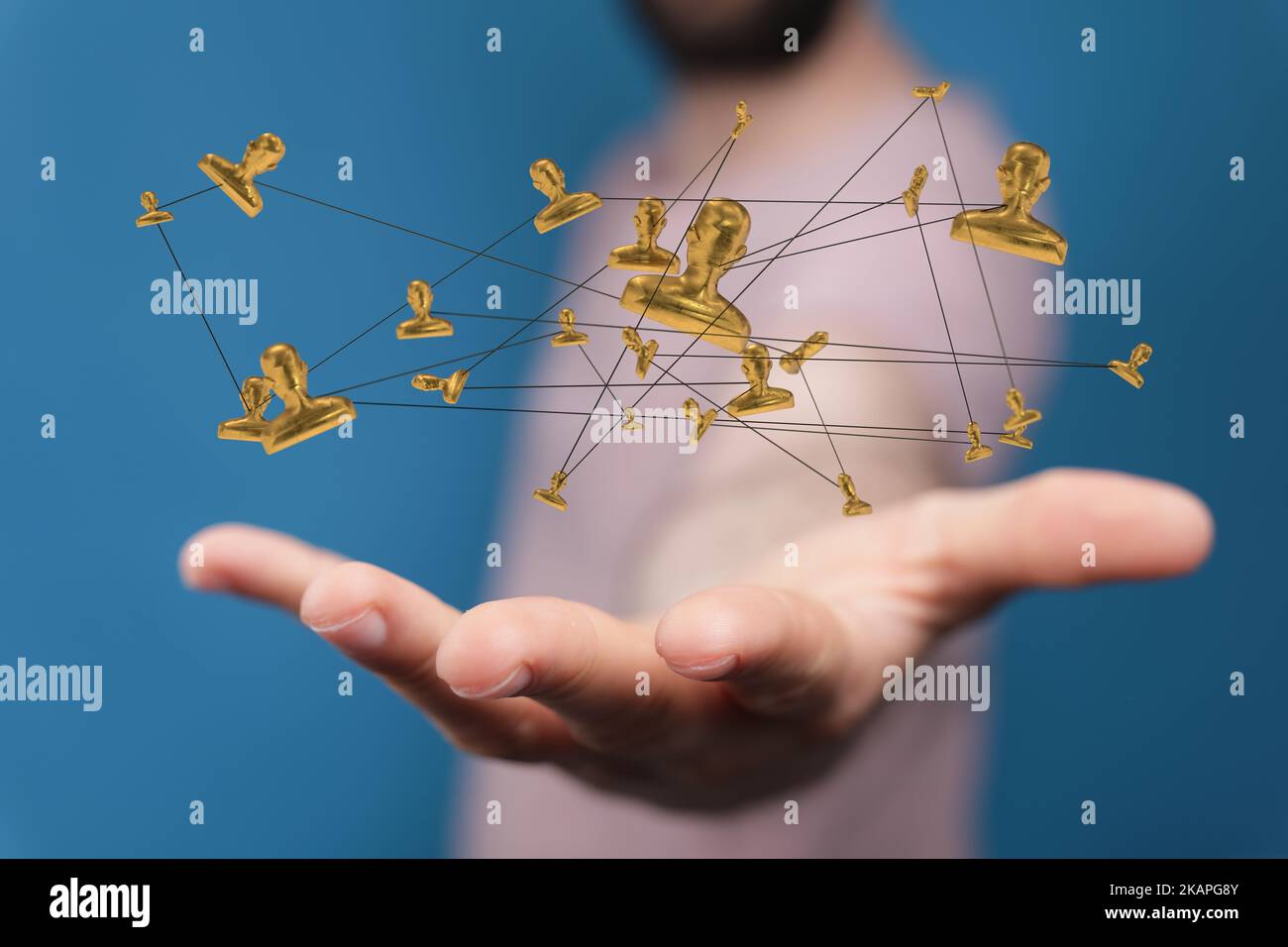 A man presenting 3D rendered people signs above his palm Stock Photo ...