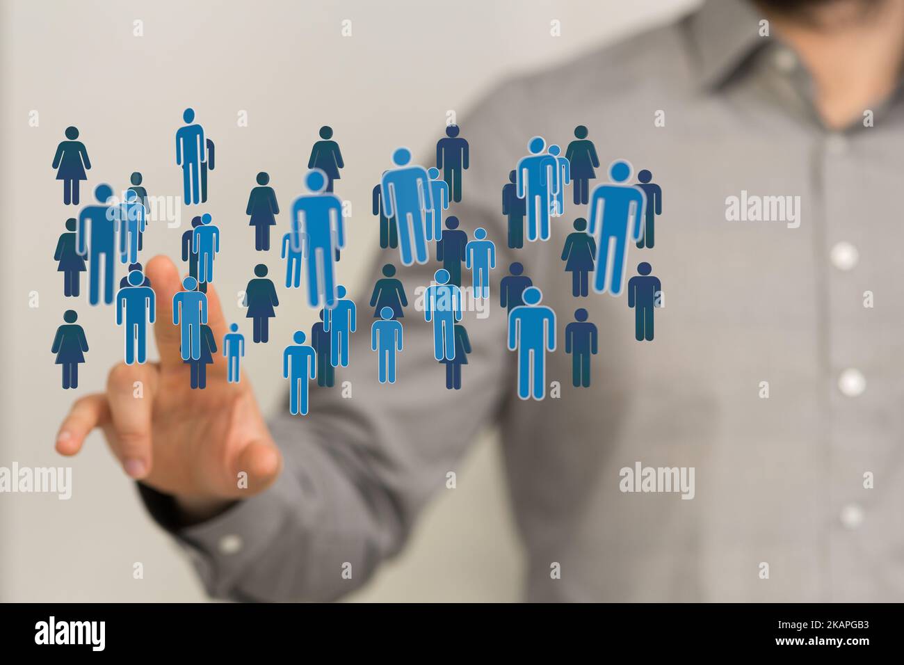 A man touching 3D rendered people signs Stock Photo - Alamy
