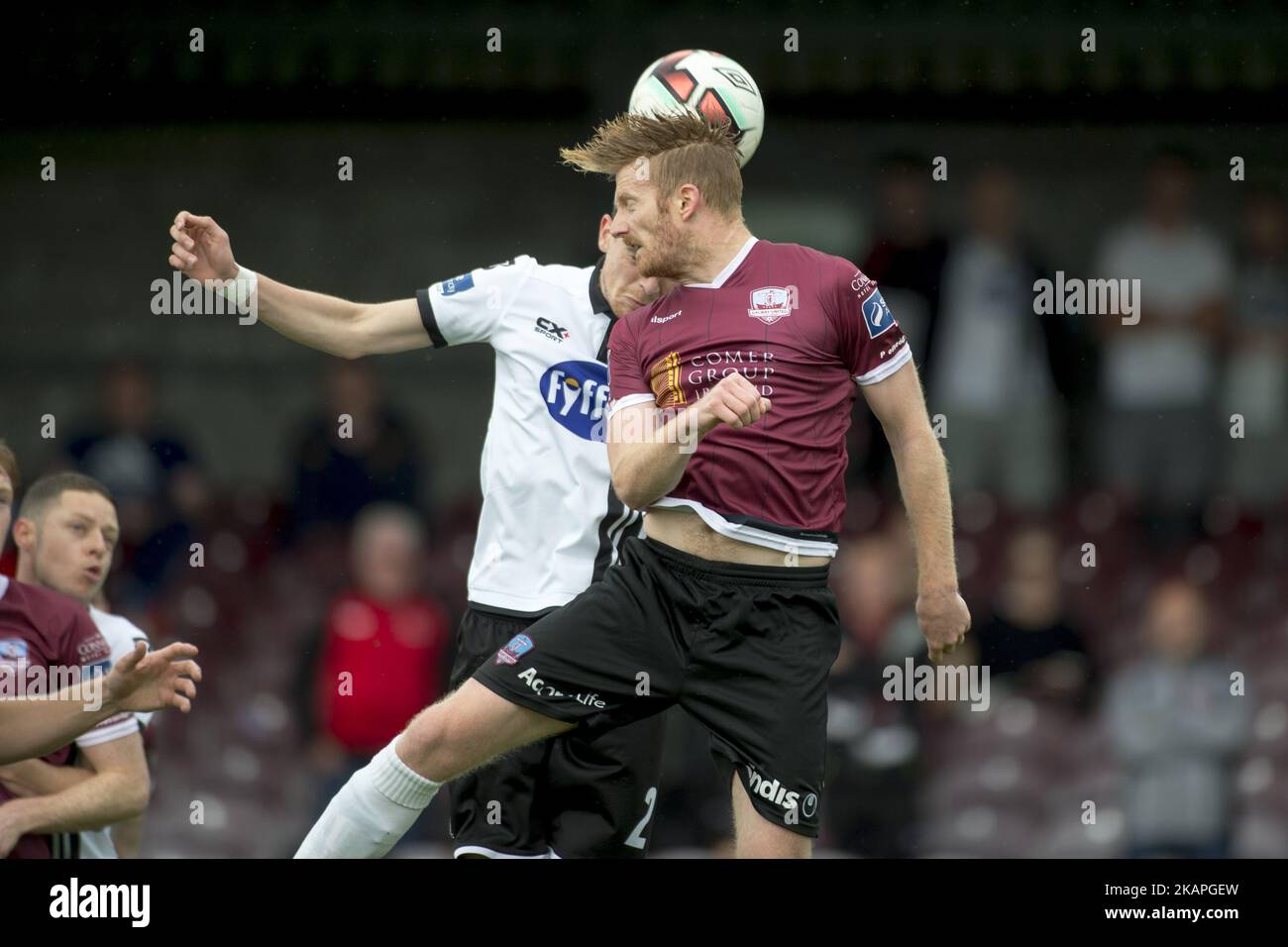 Paul Sinnott of Galway and Sean Gannon of Dundalk jump for the ball ...