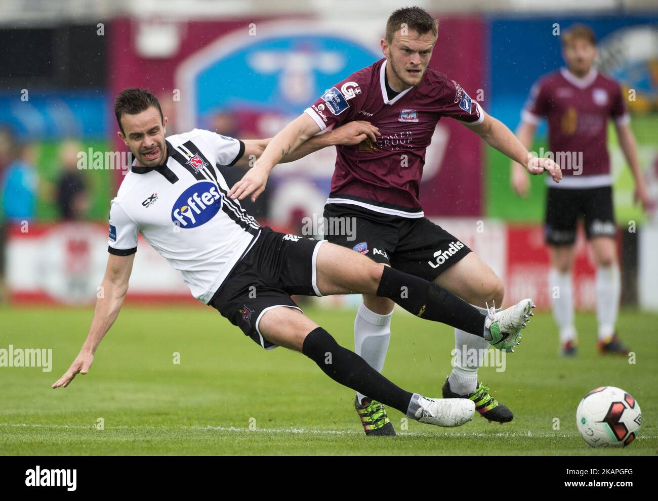 David Cawley of Galway fights with Robbie Benson of Dundalk during the ...