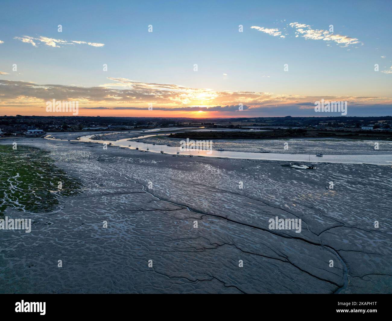 A beautiful view of mud flats at low tide at sunset Stock Photo - Alamy