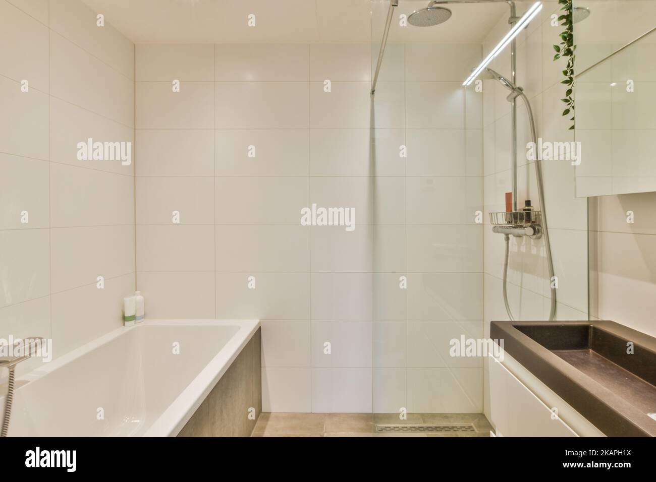 Modern home interior design of white bathroom with open bathtub from ...