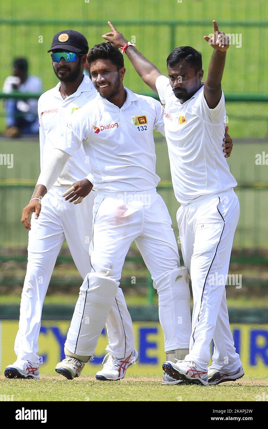 Sri Lankan cricketer Malinda Pushpakumara (R) celebrates with his team ...
