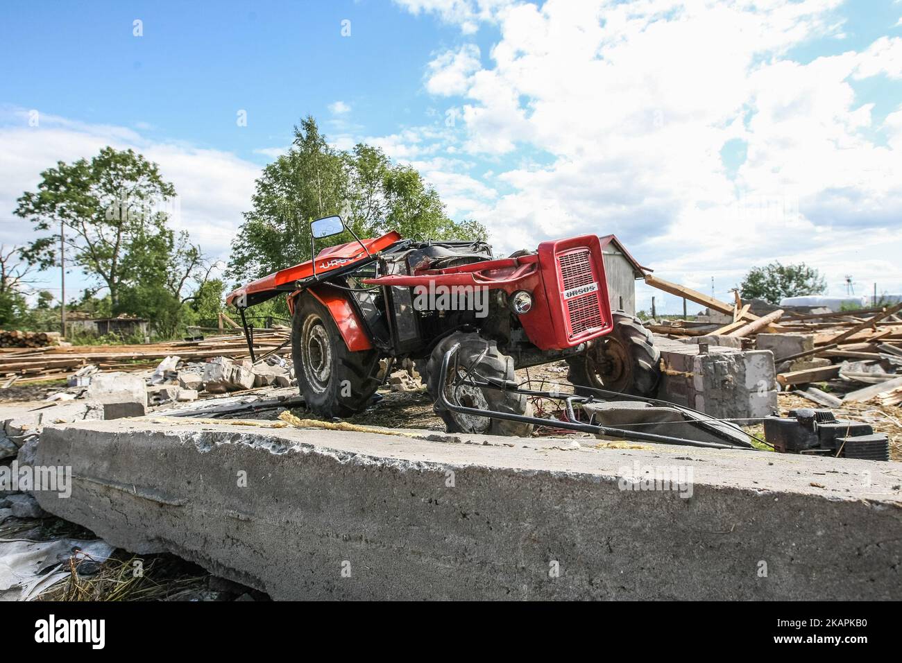 Destroyed building and smashed tractor is seen in the Sylczno village ...
