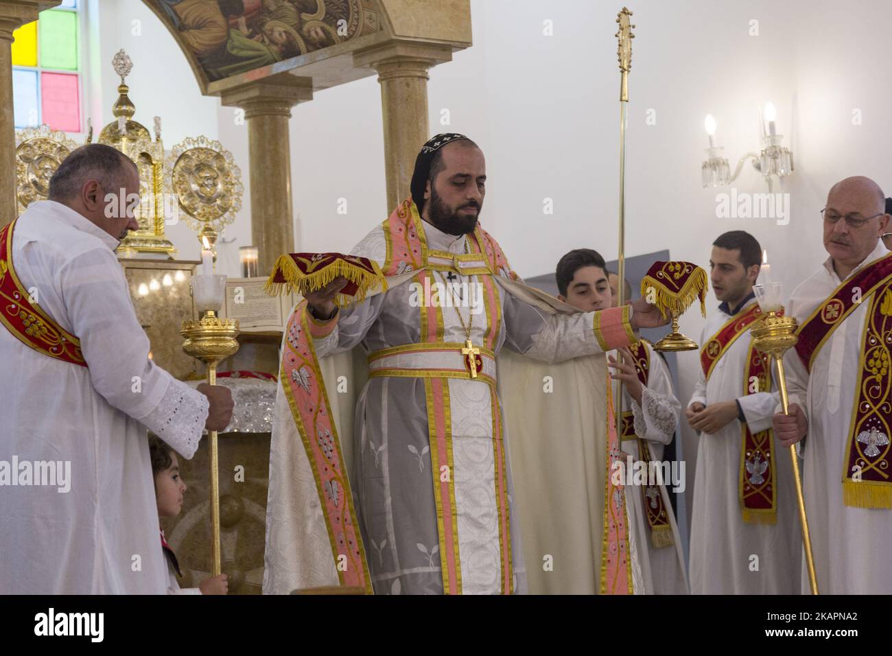 Iraqi Christians hold the Holy Mass in the St. Thomas Cathedral in ...