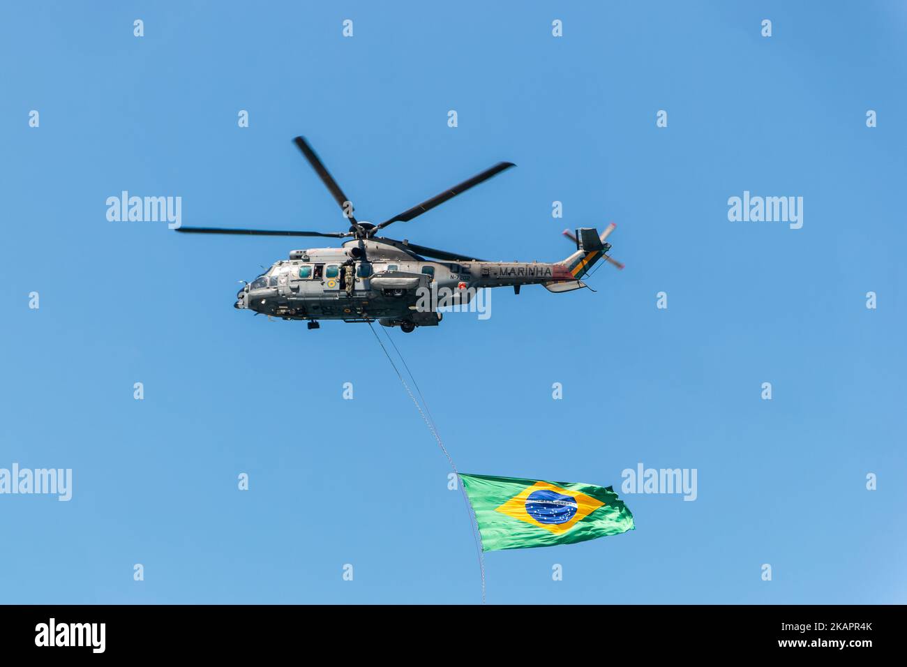 helicopter with the flag of Brazil in Copacabana in Rio de Janeiro ...