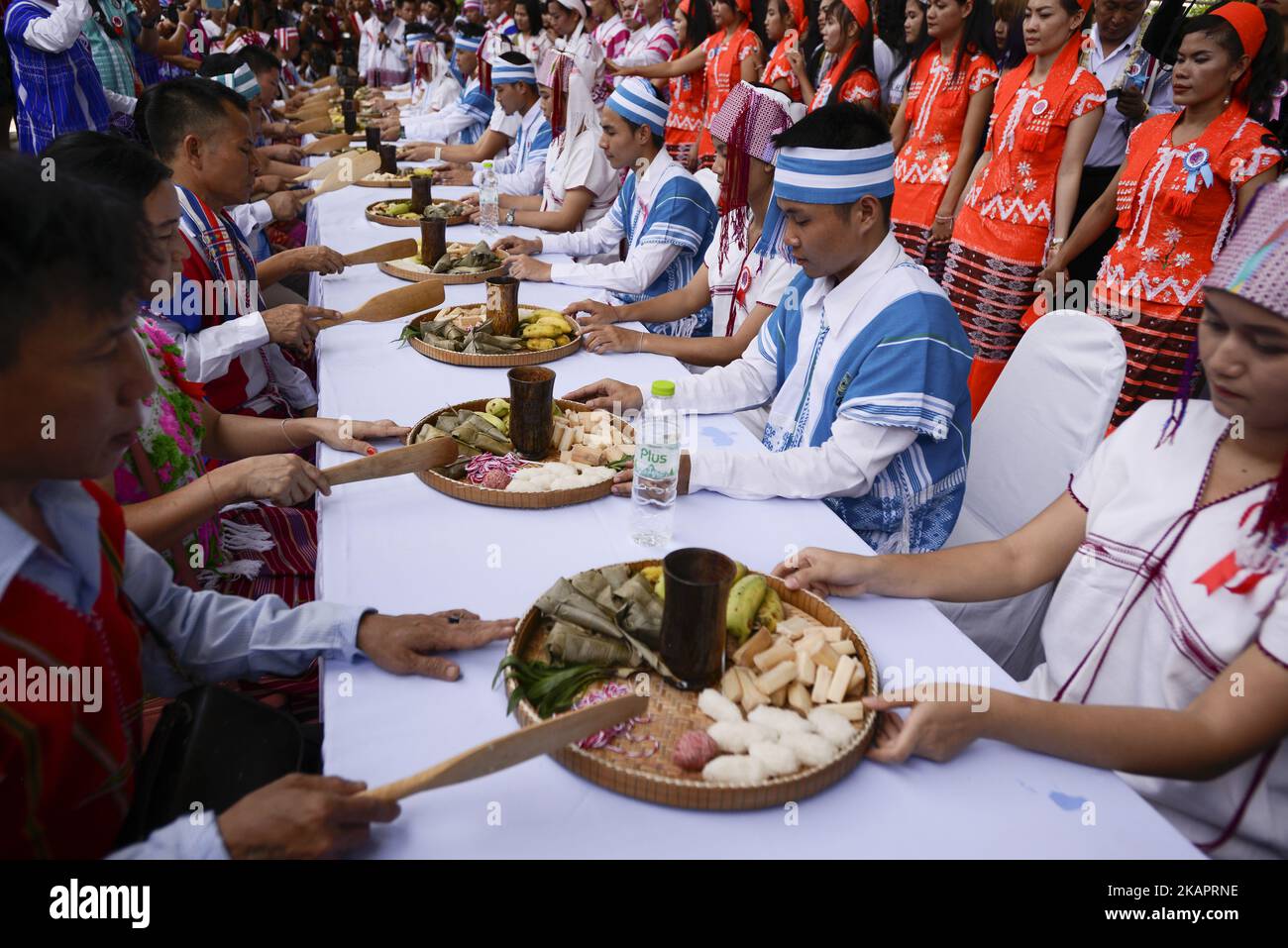 Members of the Karen during hold their Wrist tying ceremony in Bangkok ...