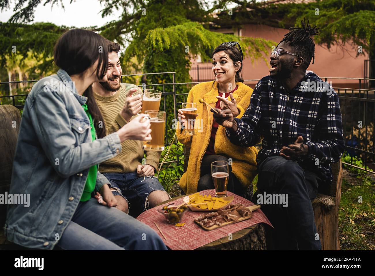 Multiethnic friends celebrating reunion party hi-res stock photography ...