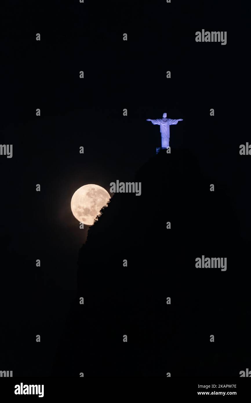 full moon and Christ the Redeemer in Rio de Janeiro, Brazil - September ...